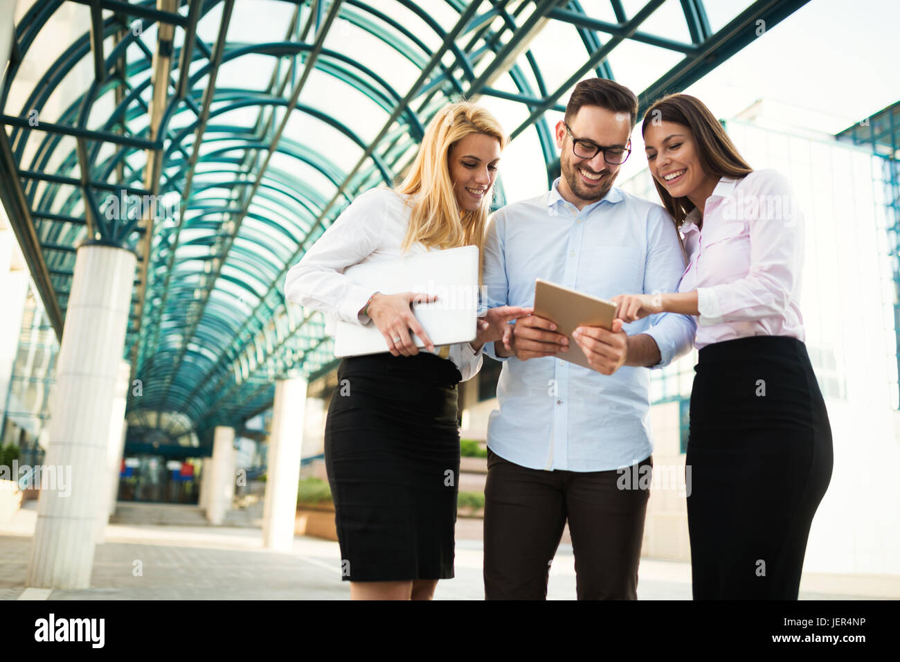 Picture of young attractive business partners standing outdoor Stock ...