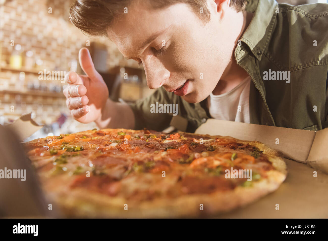 Enjoying pizza at home hi-res stock photography and images - Alamy