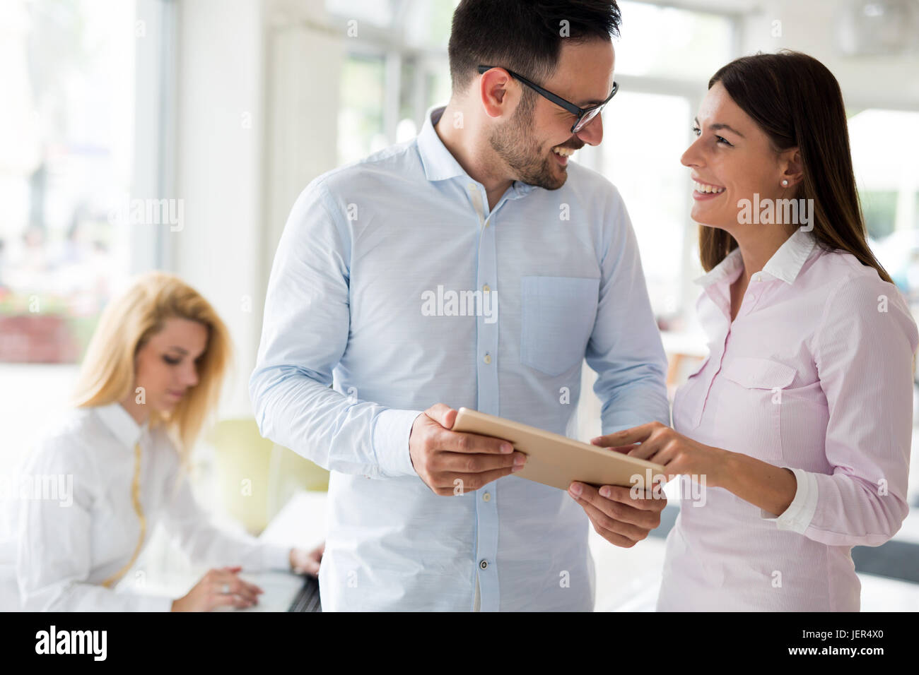 Picture of handsome man and beautiful woman as business partners ...