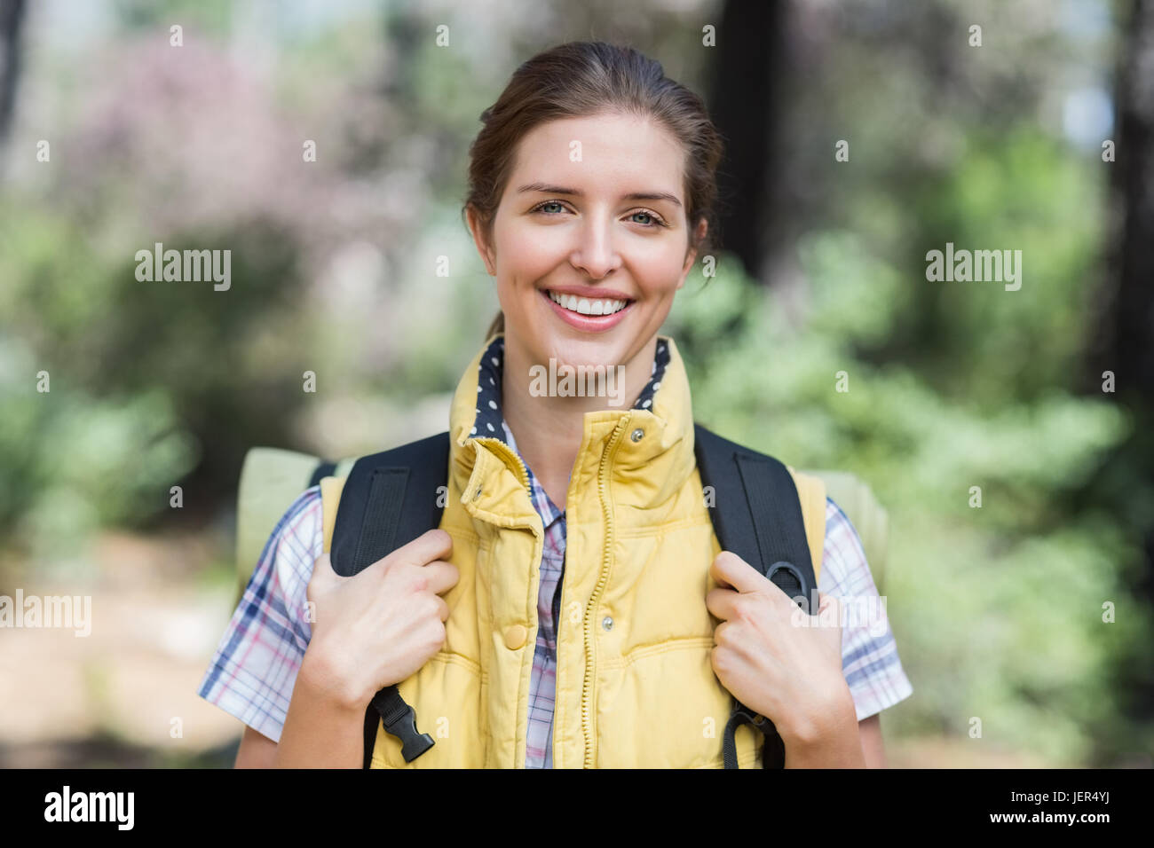 Portrait of beautiful woman while hiking Stock Photo - Alamy