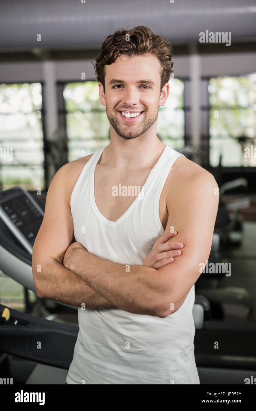 Handsome man standing in gym Stock Photo - Alamy