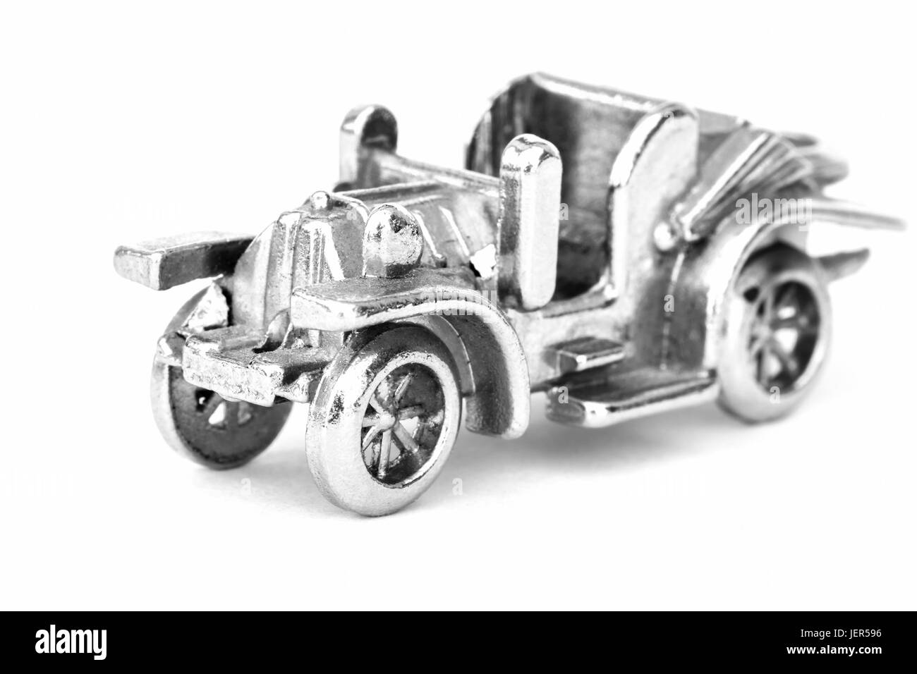 Metal chrome model vintage car on a white background Stock Photo - Alamy