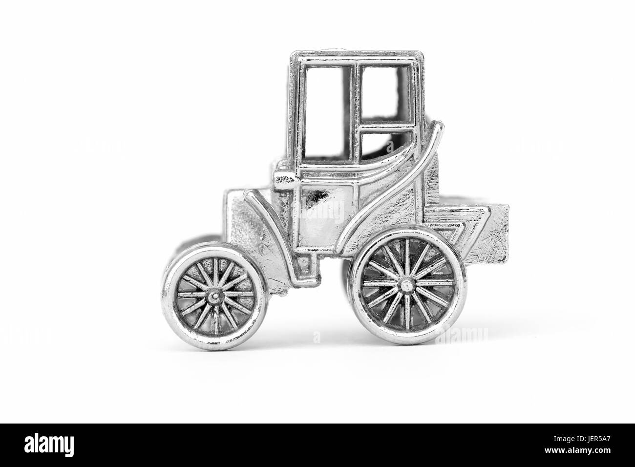 Metal chrome model vintage car on a white background Stock Photo - Alamy