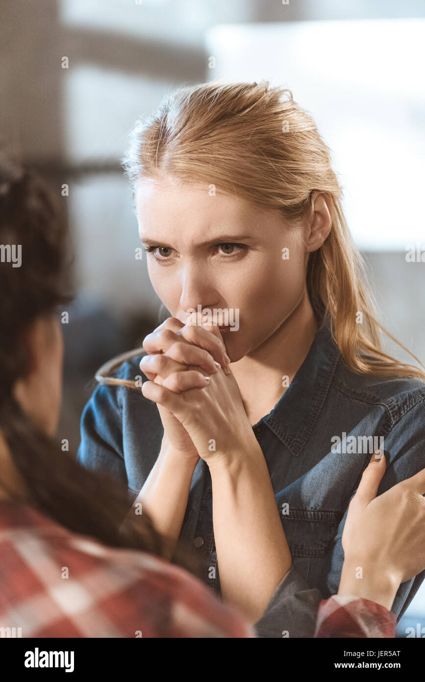 Young woman supporting her girlfriend in depression Stock Photo - Alamy