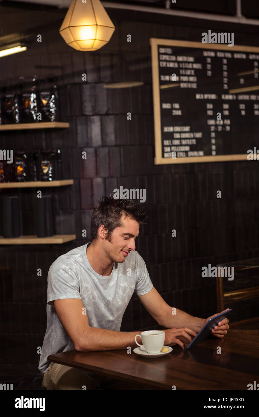 Man using a tablet Stock Photo - Alamy