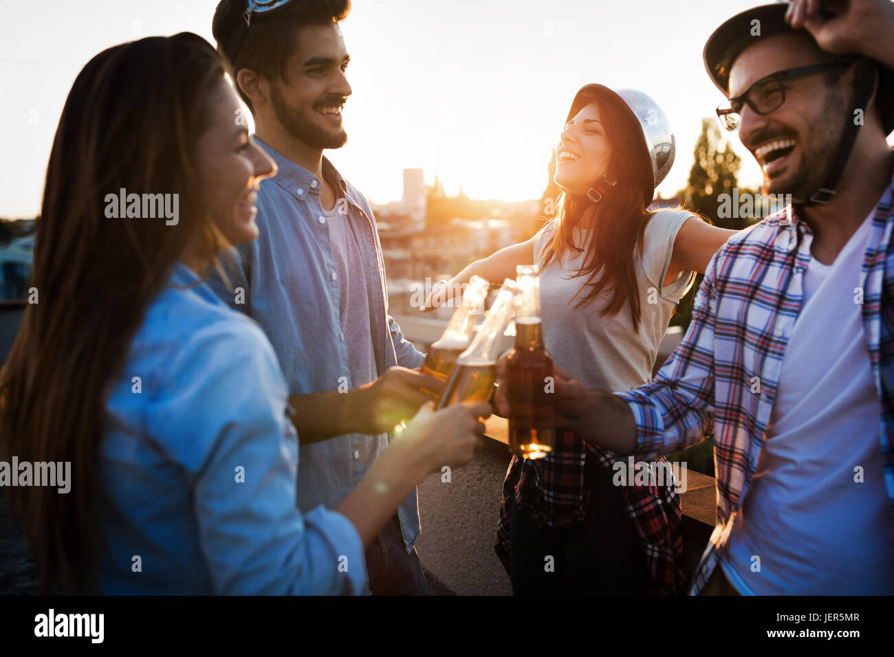 Happy cheerful friends spending fun times together and drinking Stock ...