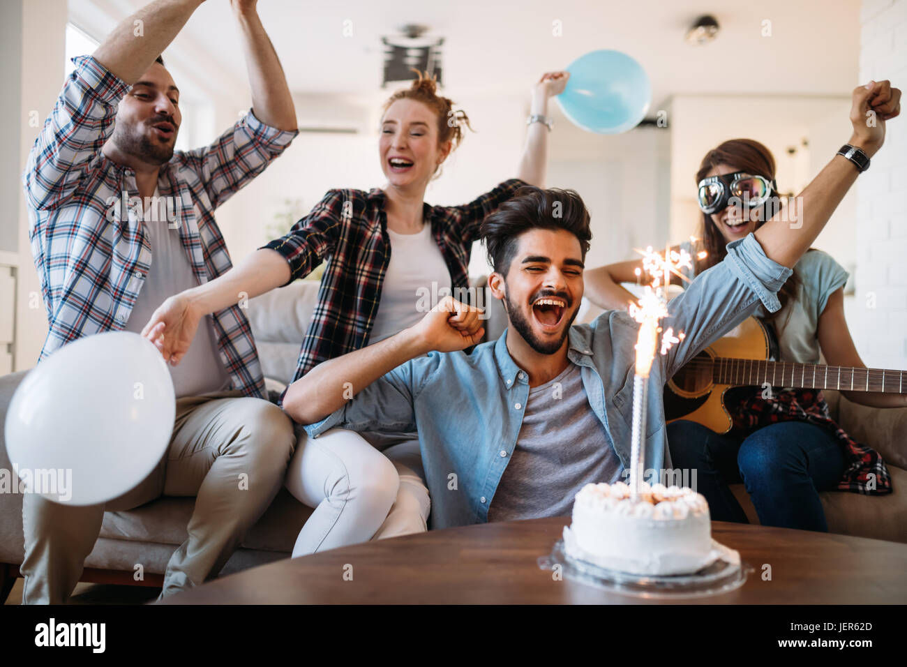 Cheerful young friends having lot of fun on party Stock Photo - Alamy