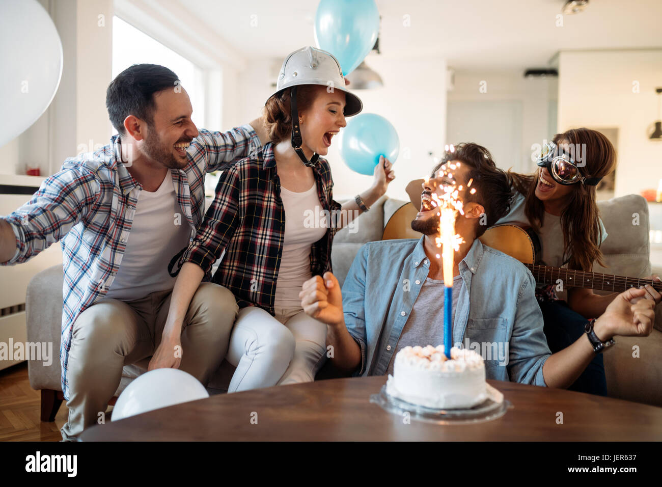Cheerful young friends having lot of fun on party Stock Photo - Alamy