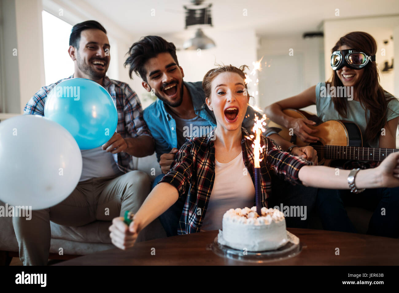 Cheerful young friends having lot of fun on party Stock Photo - Alamy