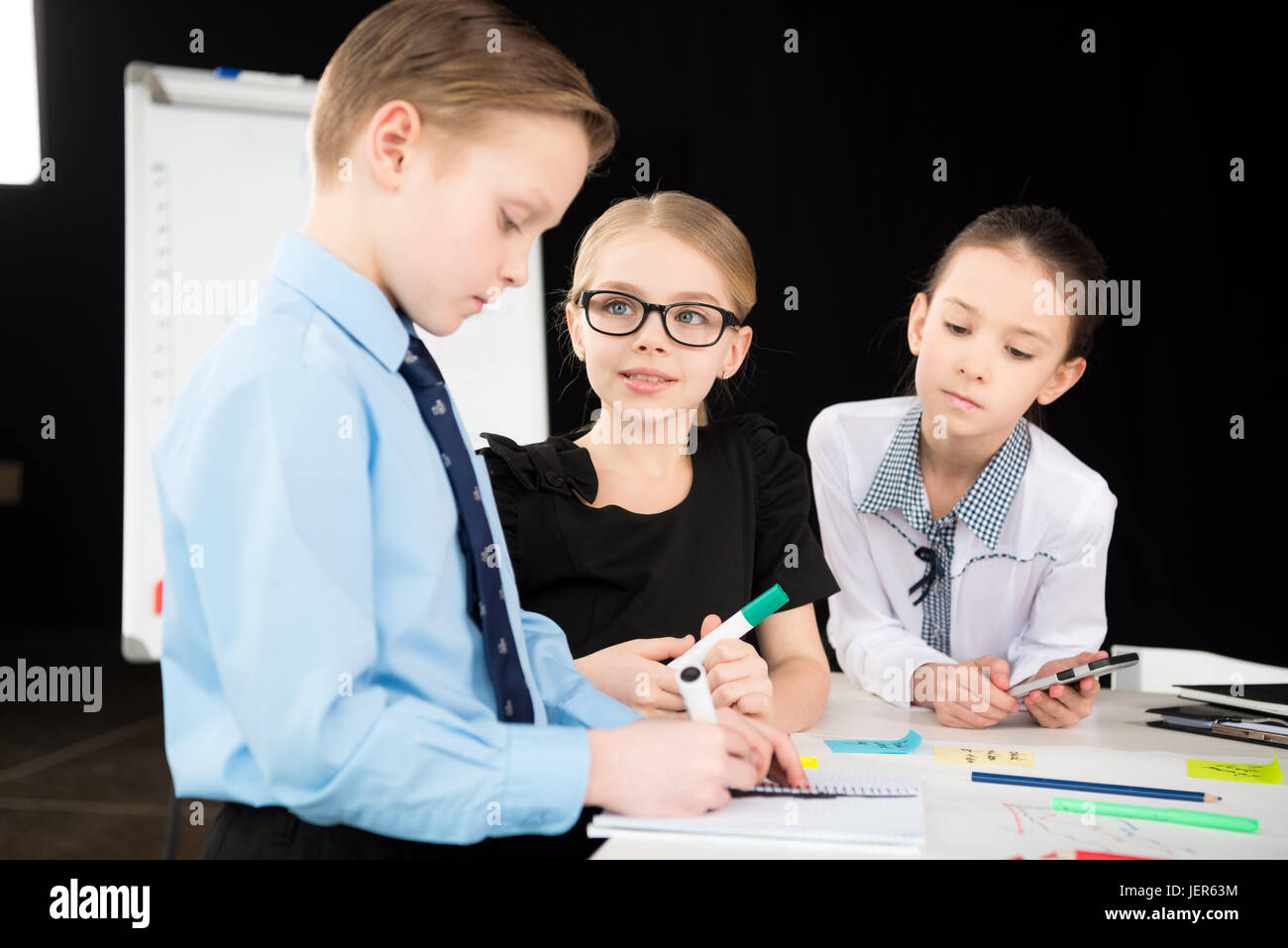 Children working in office like adult business people Stock Photo - Alamy