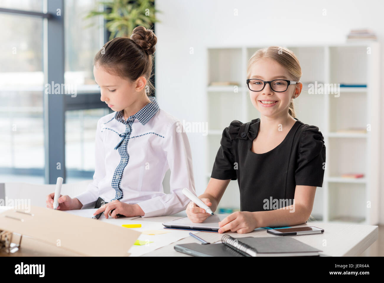Children working in office like adult business people Stock Photo - Alamy