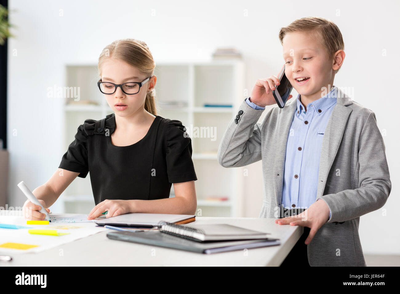 Children working in office like adult business people Stock Photo - Alamy