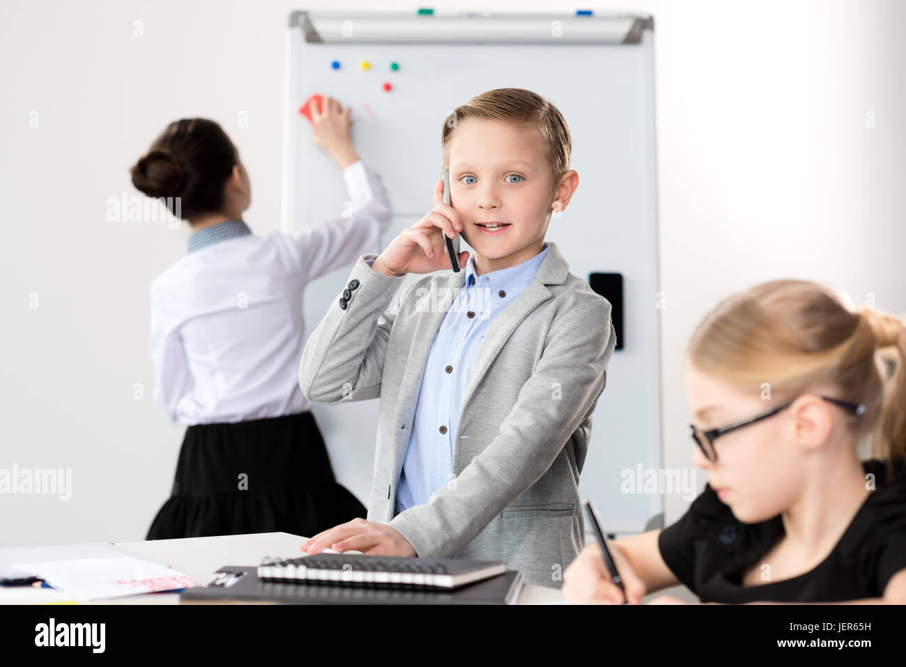Children working in office like adult business people Stock Photo - Alamy