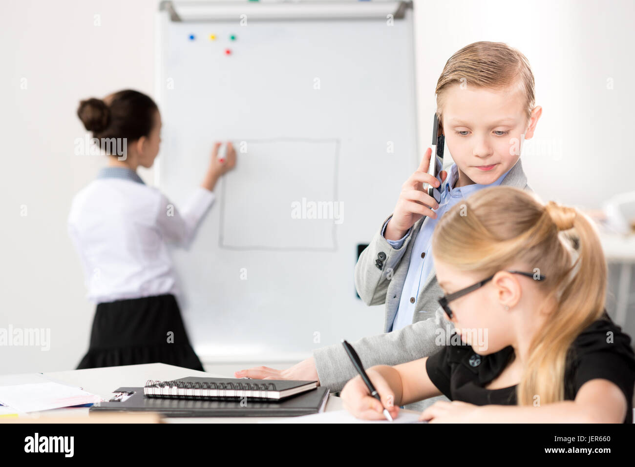 Children working in office like adult business people Stock Photo - Alamy
