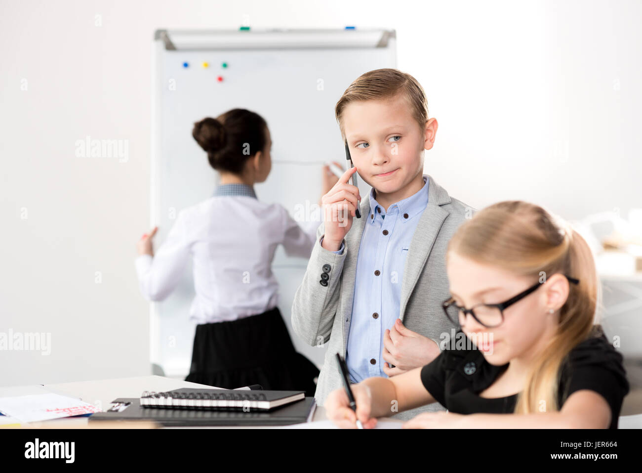 Children working in office like adult business people Stock Photo - Alamy
