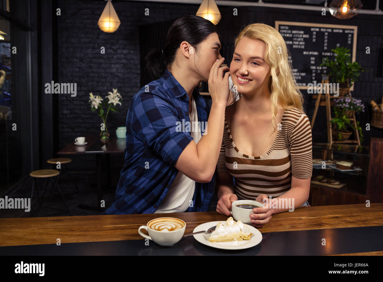 Woman sharing secret man hi-res stock photography and images - Alamy