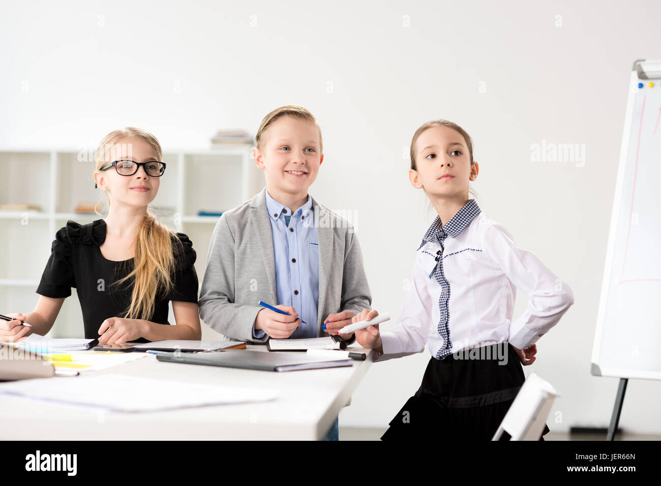 Children working in office like adult business people Stock Photo - Alamy