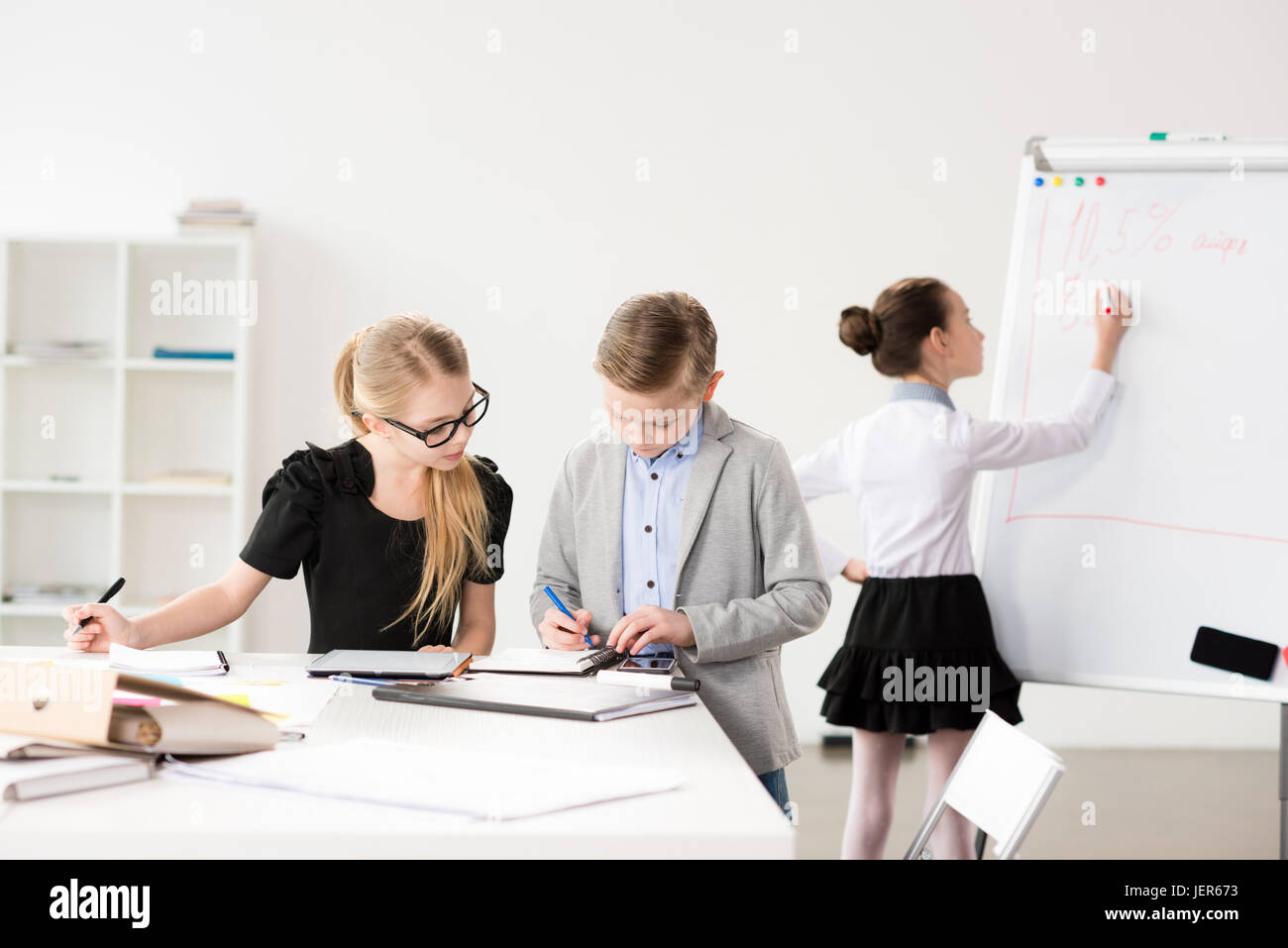 Children working in office like adult business people Stock Photo - Alamy