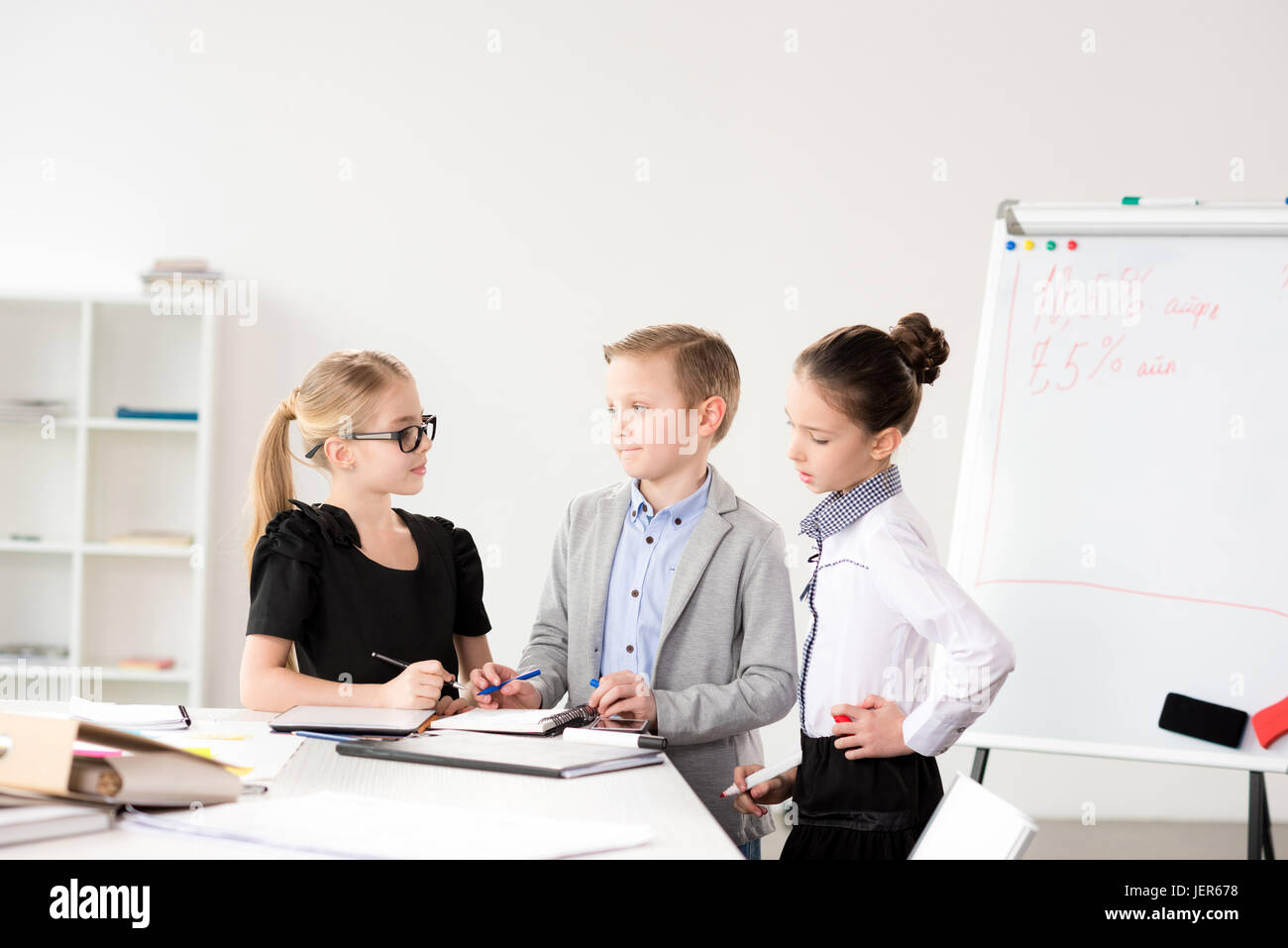 Children working in office like adult business people Stock Photo - Alamy