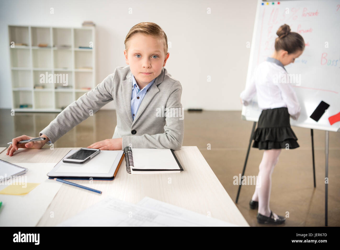 Children working in office like adult business people Stock Photo - Alamy