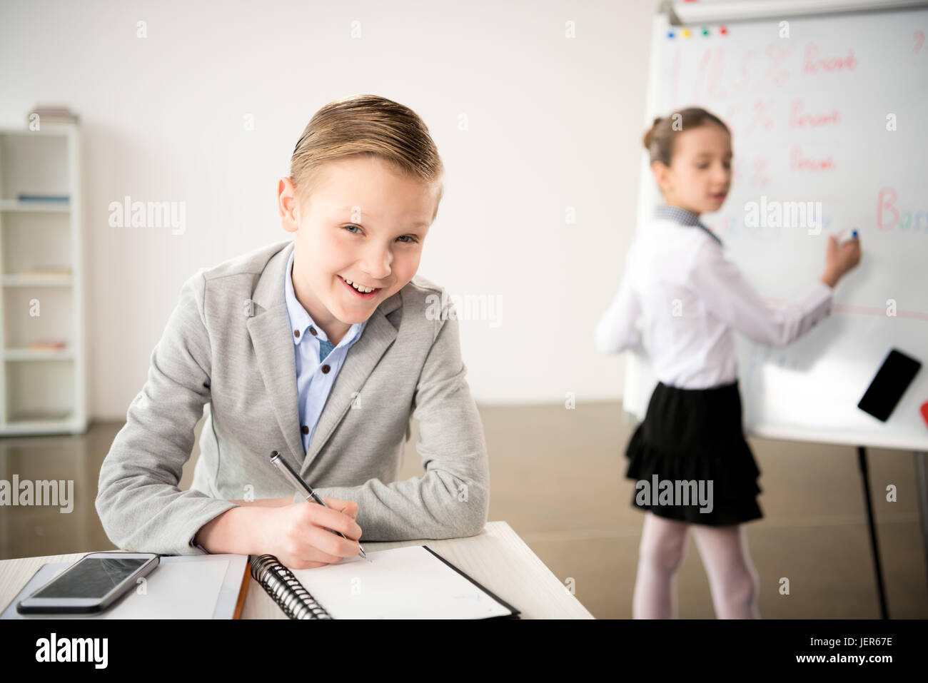 Children working in office like adult business people Stock Photo - Alamy