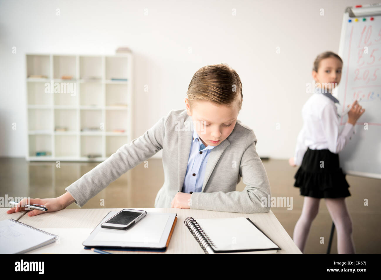 Children working in office like adult business people Stock Photo - Alamy