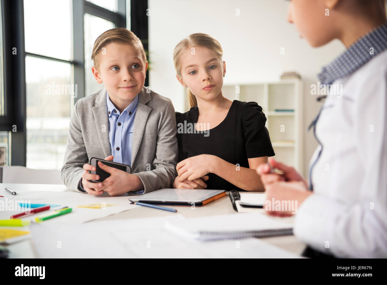 Children working in office like adult business people Stock Photo - Alamy