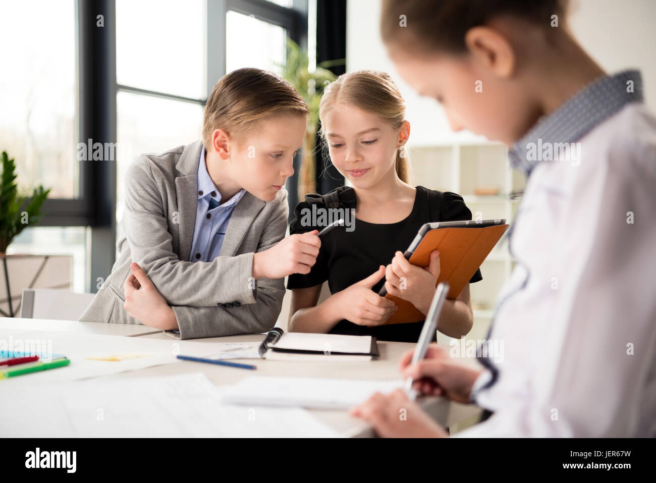 Children working in office like adult business people Stock Photo - Alamy