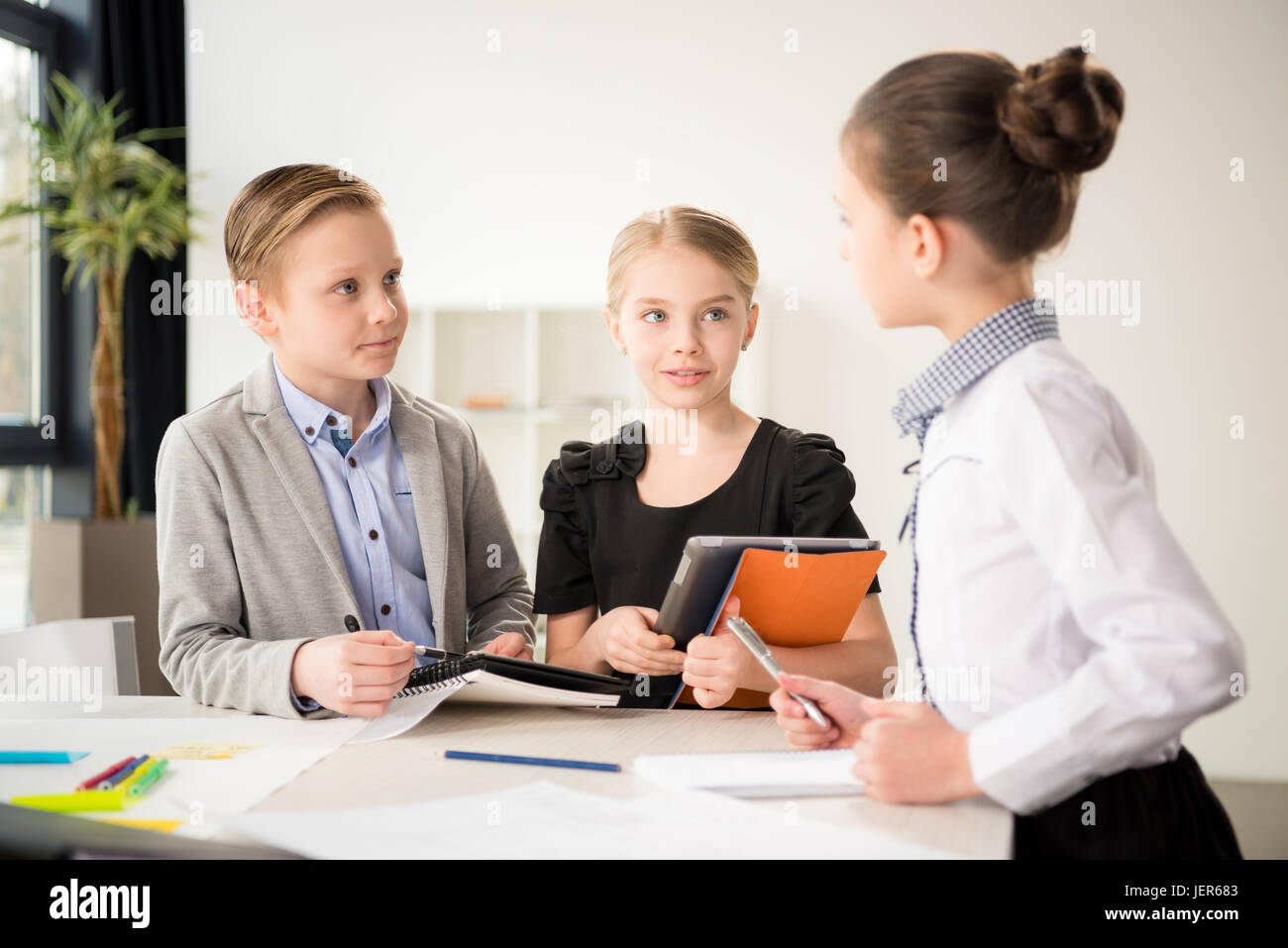 Children working in office like adult business people Stock Photo - Alamy