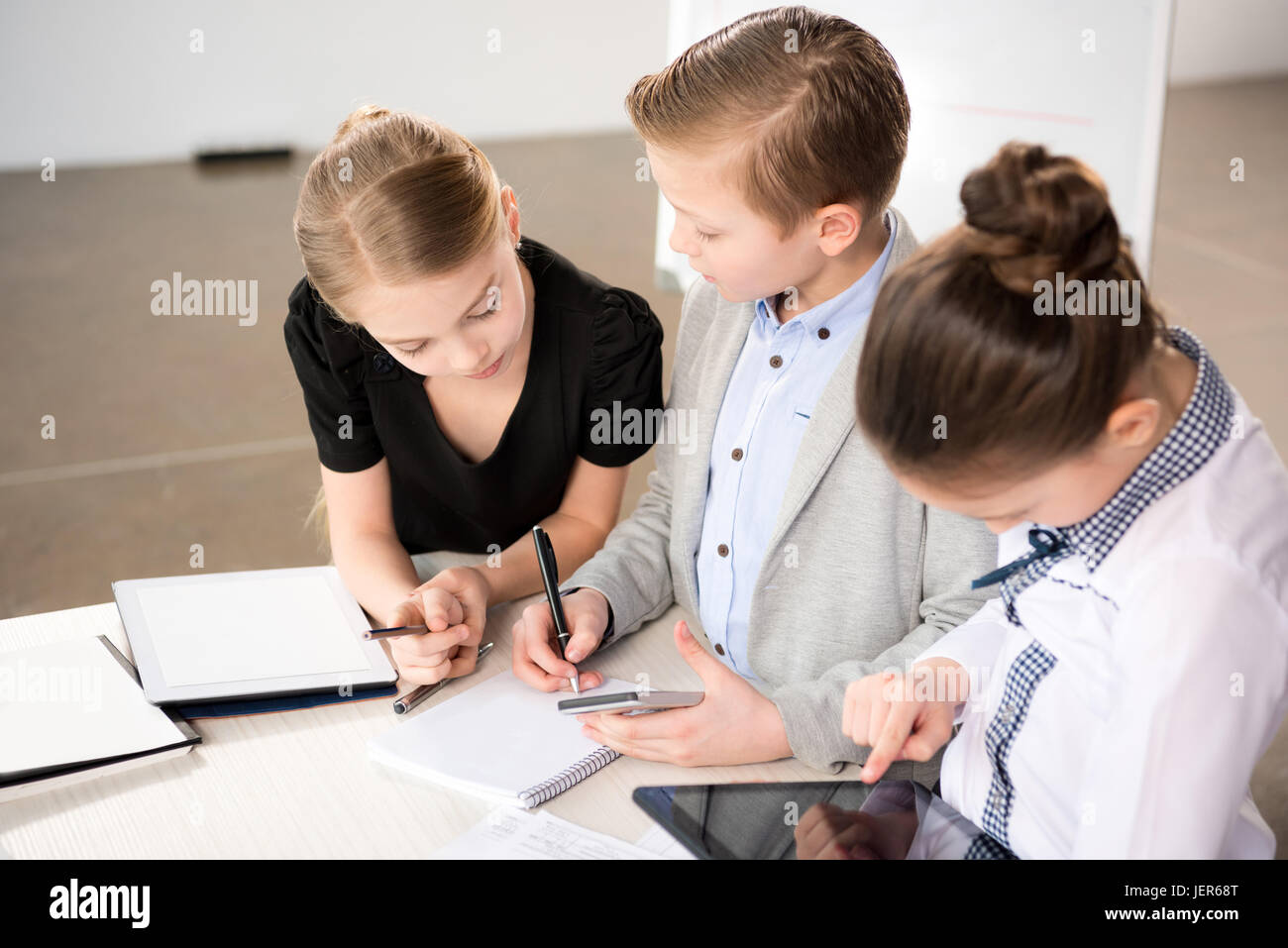 Children working in office like adult business people Stock Photo - Alamy