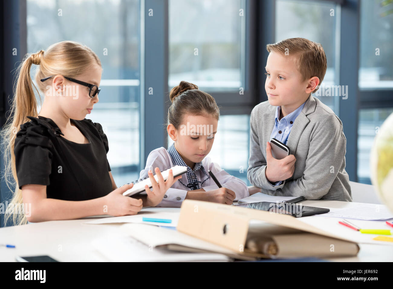 Children working in office like adult business people Stock Photo - Alamy