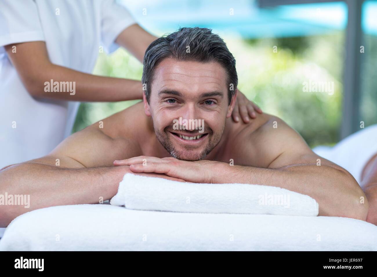 Man receiving back massage from masseur Stock Photo - Alamy