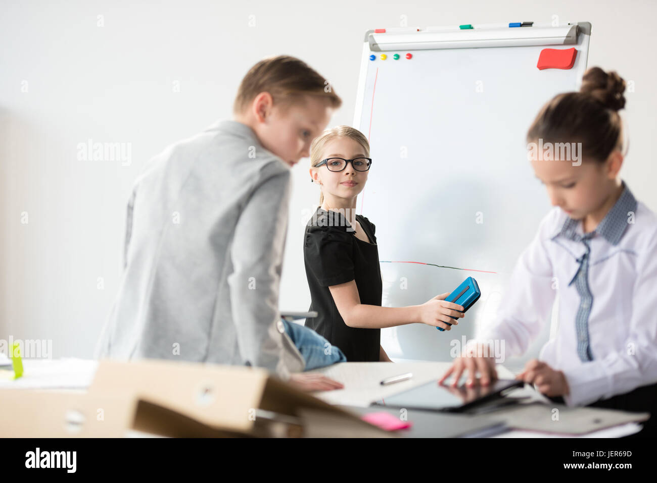 Children working in office like adult business people Stock Photo - Alamy