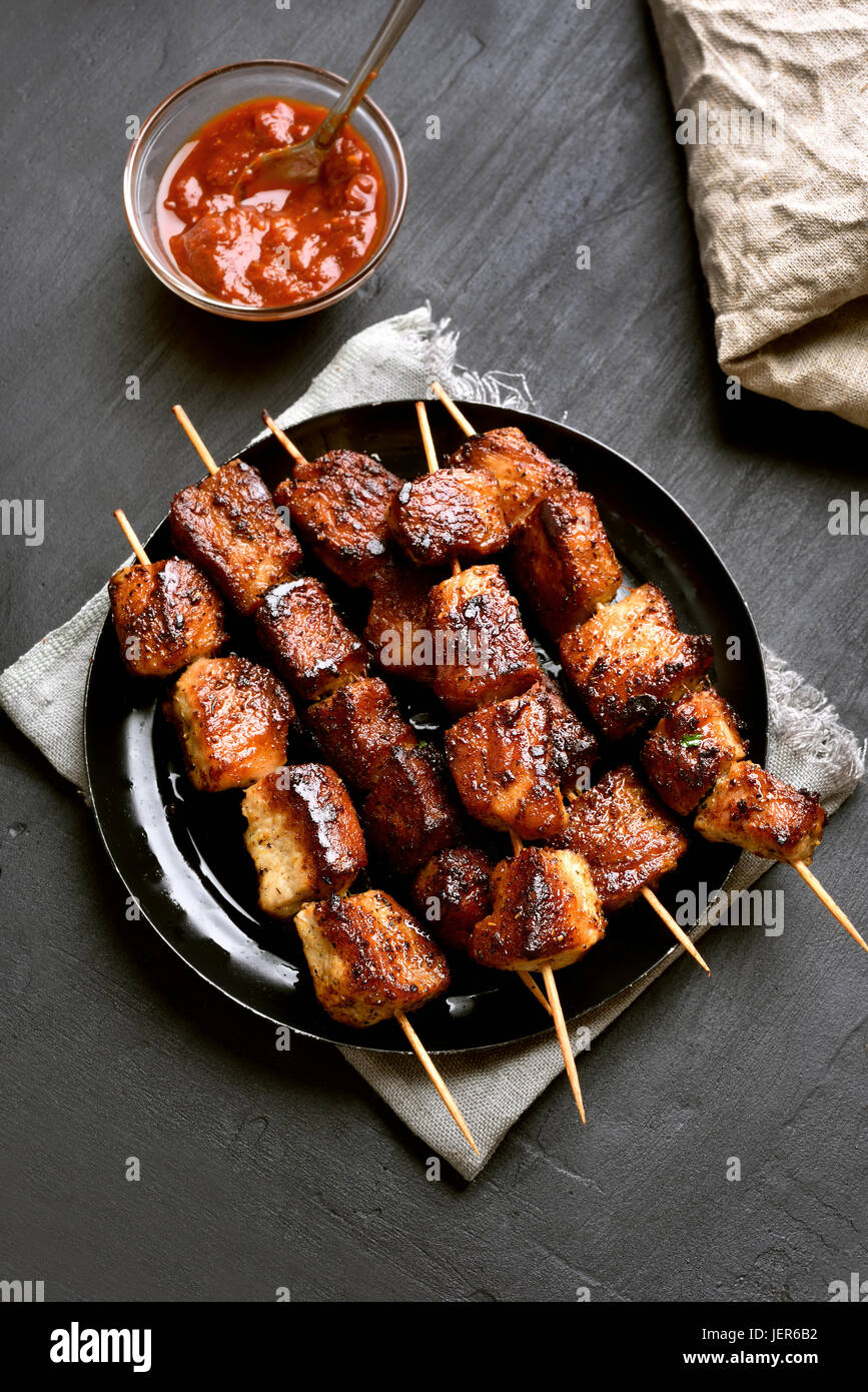 Homemade grilled pork skewers on black background, top view Stock Photo ...