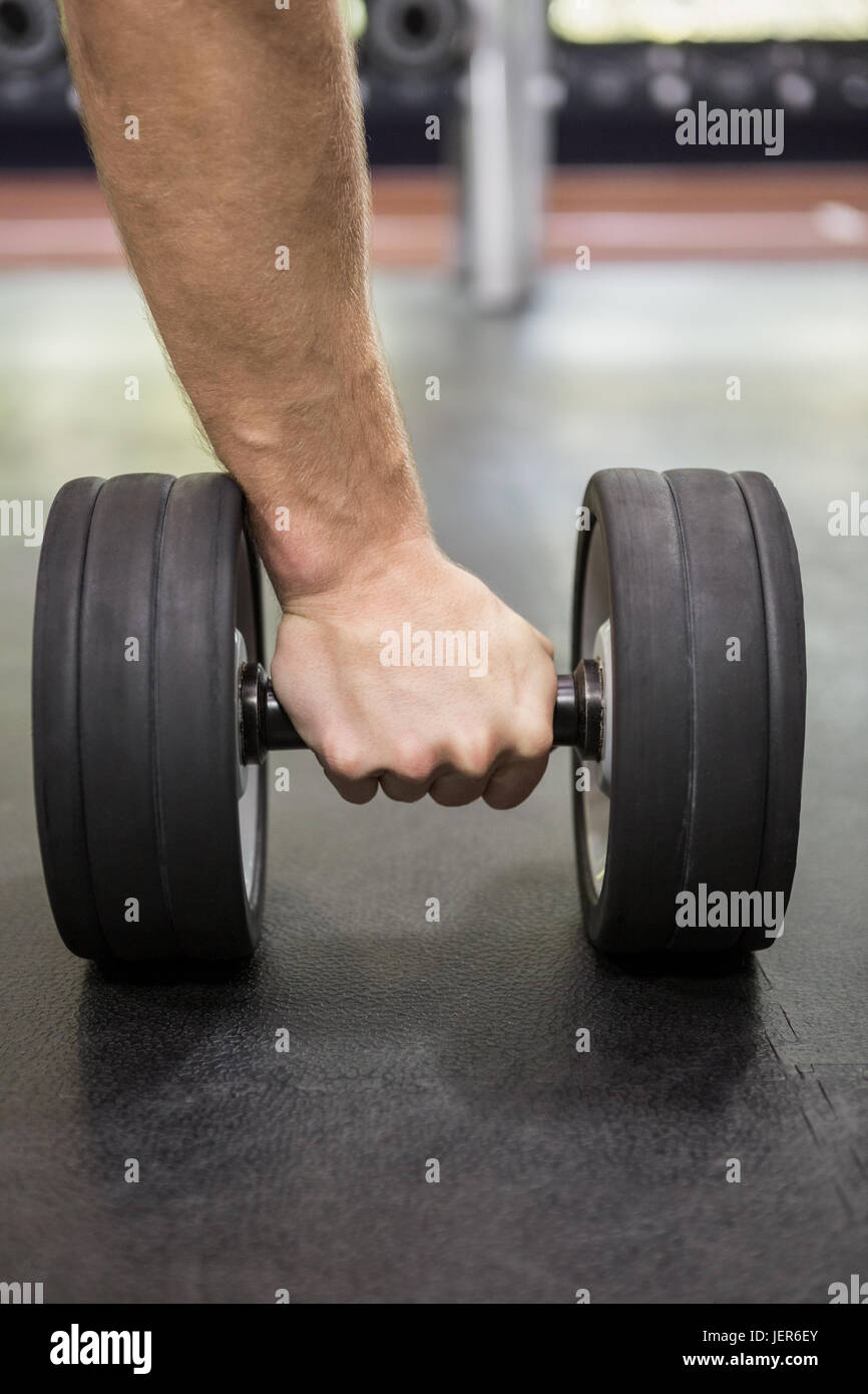 Close-up of man lifting dumbbells Stock Photo - Alamy