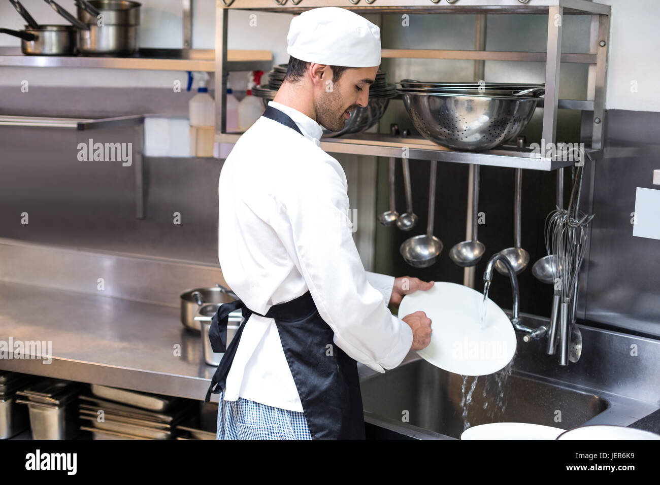 Young handsome man washing dishes hi-res stock photography and images ...