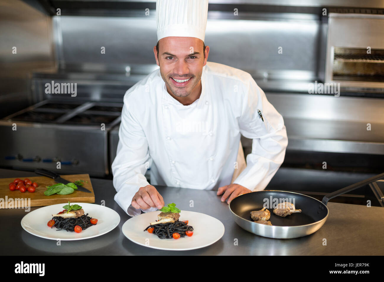 Chef putting on hat hi-res stock photography and images - Alamy