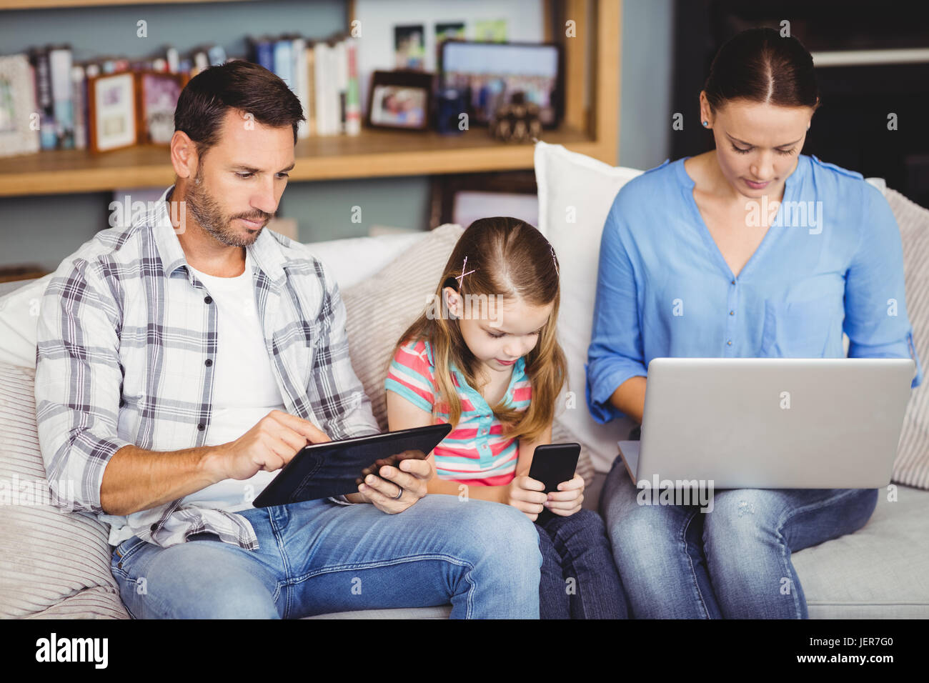 Family using modern technologies Stock Photo - Alamy
