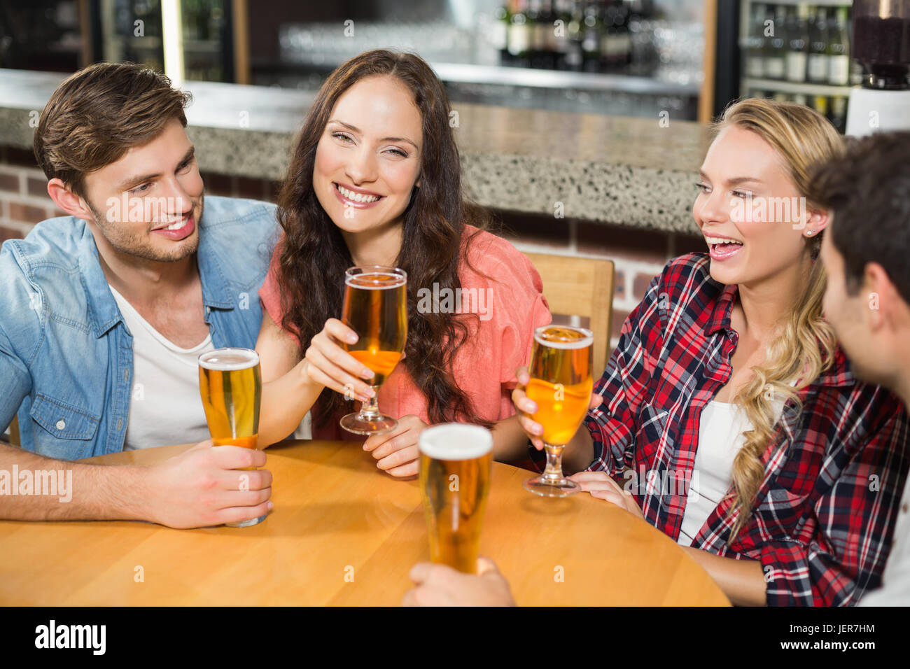 Friends drinking beer Stock Photo - Alamy