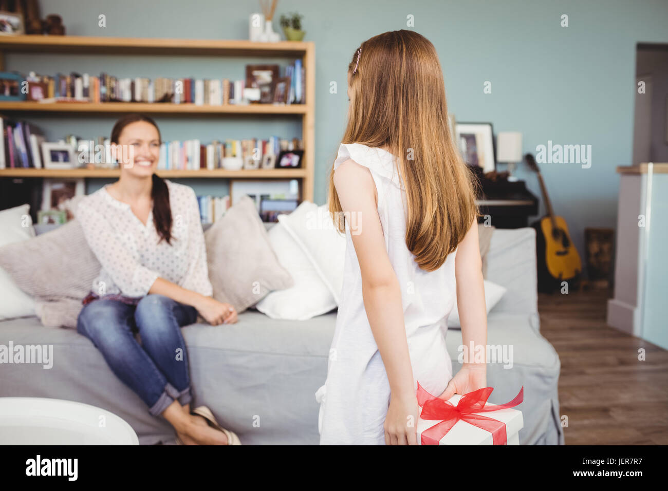 Child wrapped gift from parent hi-res stock photography and images - Alamy