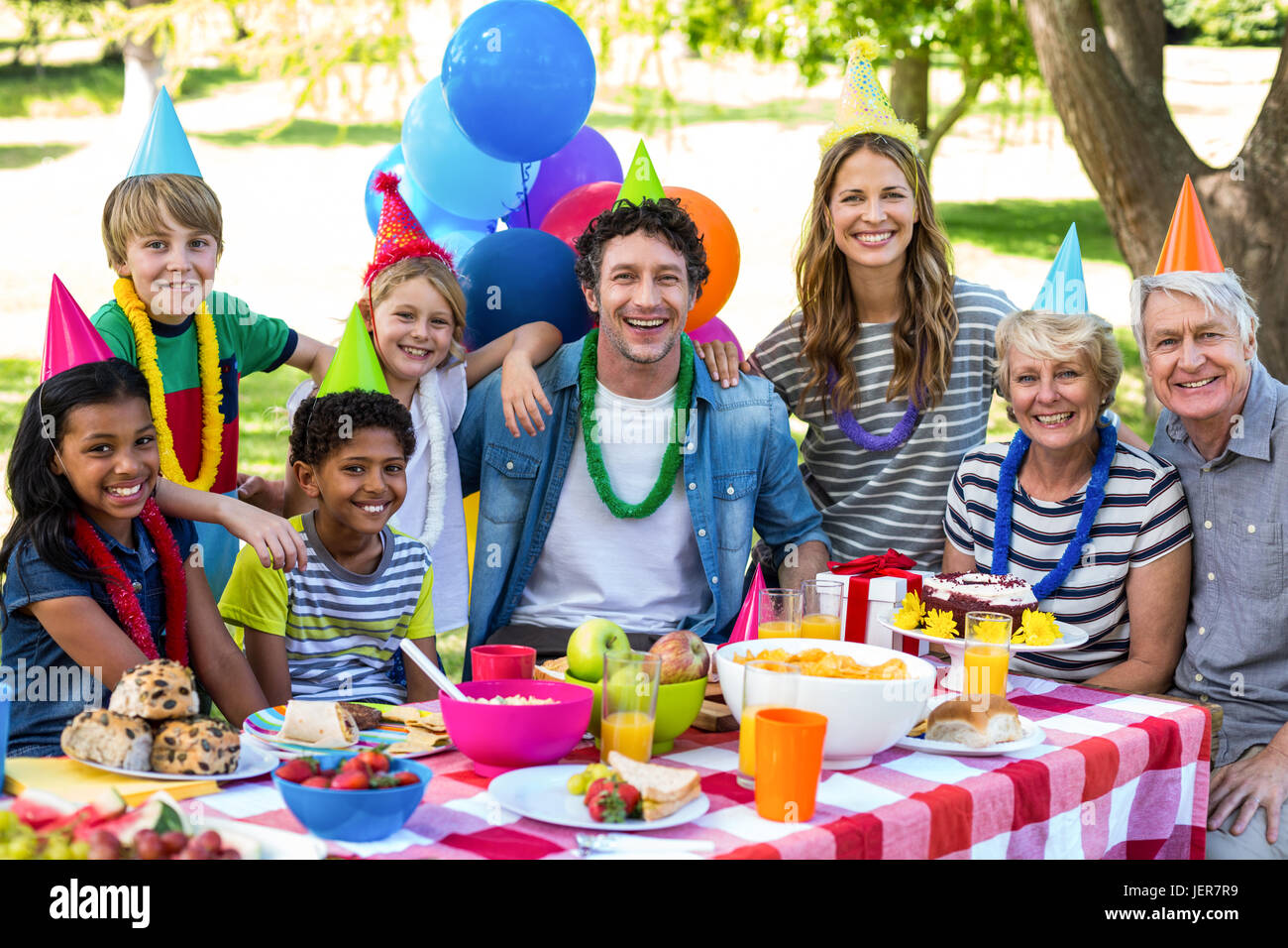 Happy family celebrating a birthday Stock Photo - Alamy