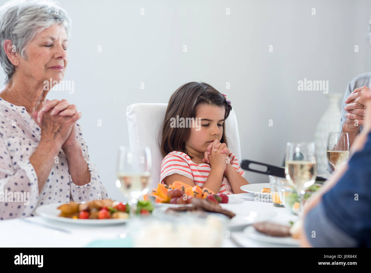 Family praying together meal dining hi-res stock photography and images ...
