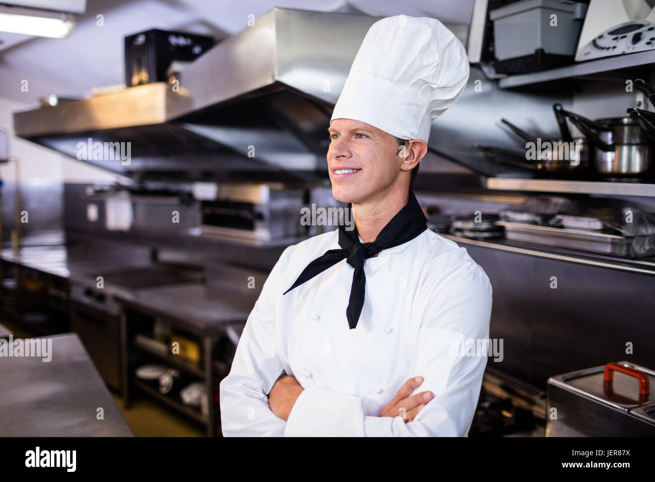 Happy male chef standing with arms crossed Stock Photo - Alamy