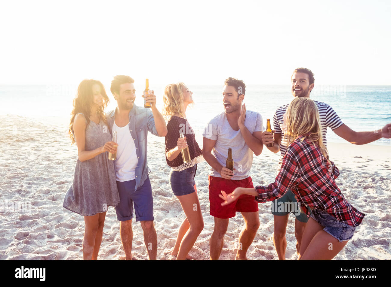 Happy friends dancing together Stock Photo - Alamy