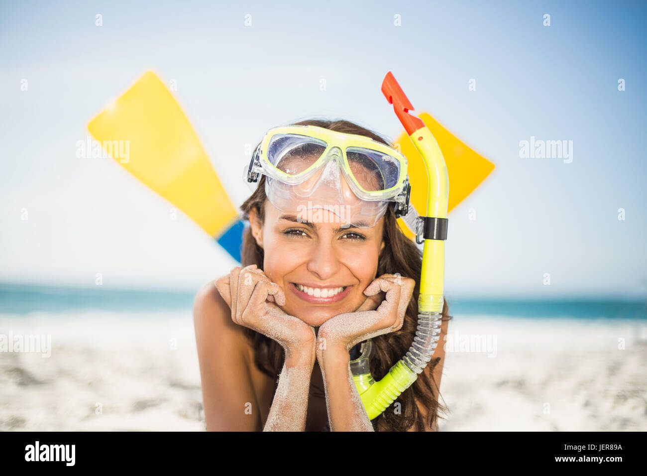 Young woman wearing flippers at the beach Stock Photo - Alamy