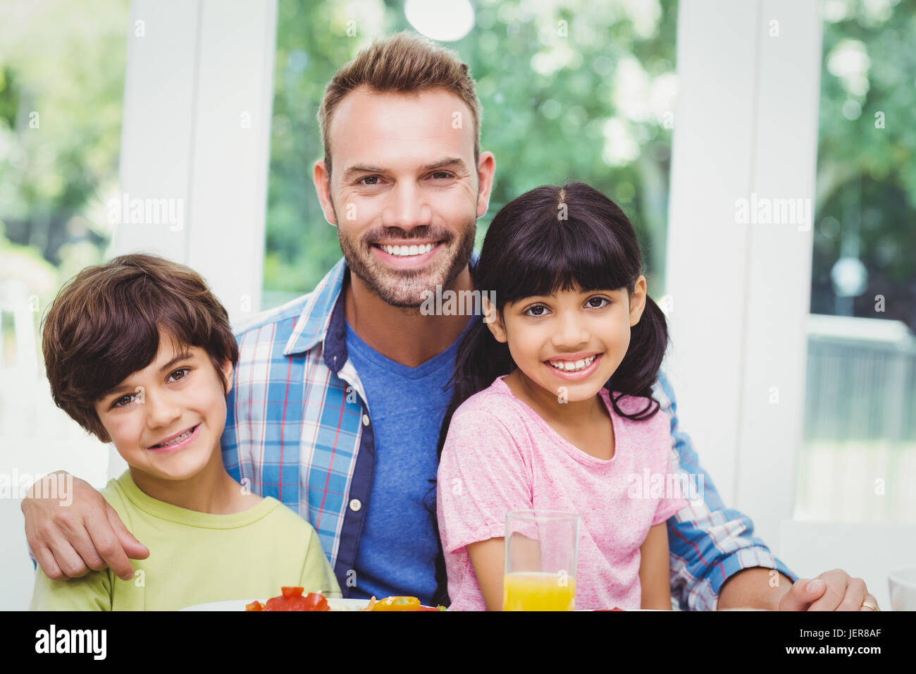 Portrait of smiling father and children Stock Photo - Alamy
