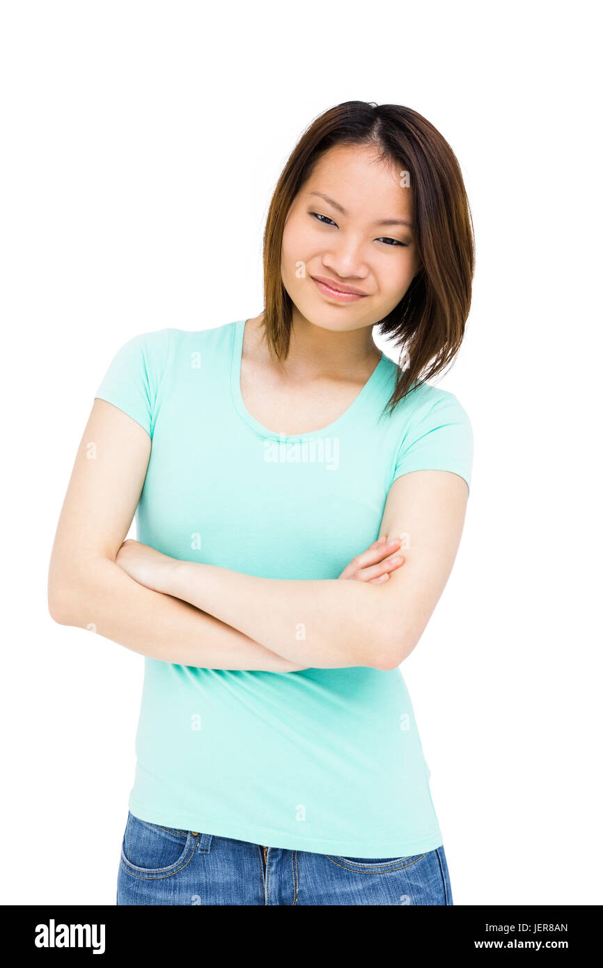 Young woman standing with arms crossed Stock Photo - Alamy