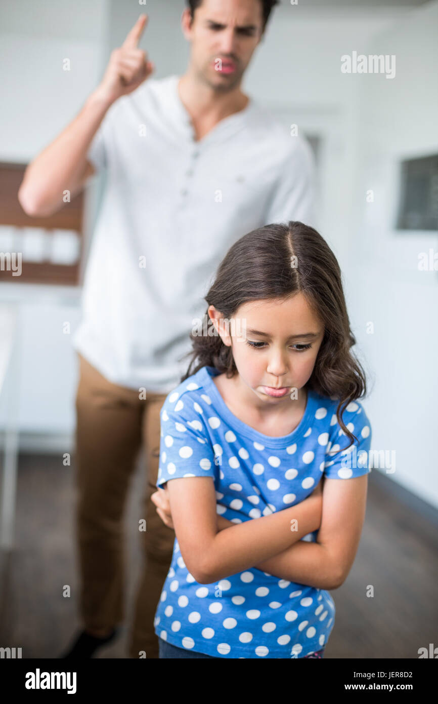 Sad daughter with arms crossed Stock Photo - Alamy