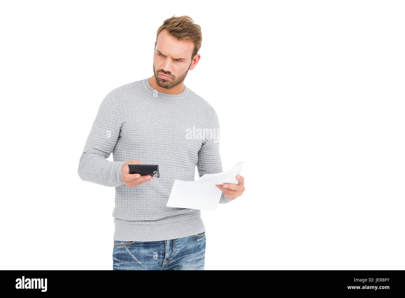 Young man calculating bill Stock Photo - Alamy