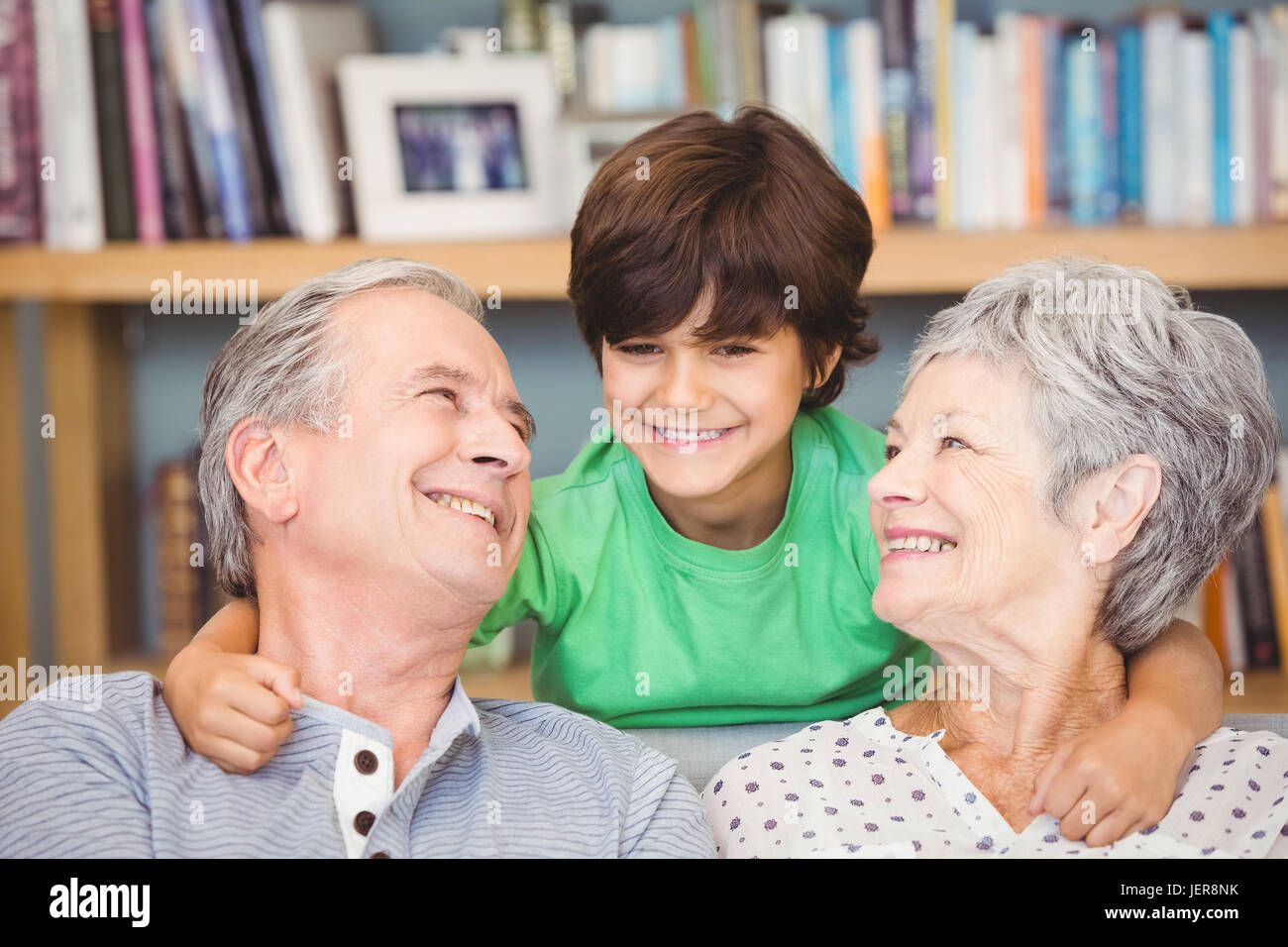 Grandson with grandparents at home Stock Photo - Alamy